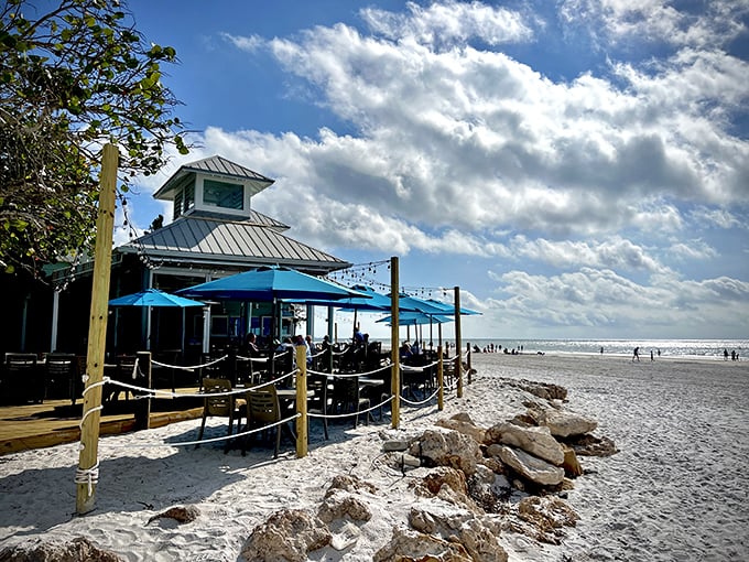 The Sandbar's weathered sign and sandy entrance say everything you need to know: leave your pretensions at home and bring your appetite instead.