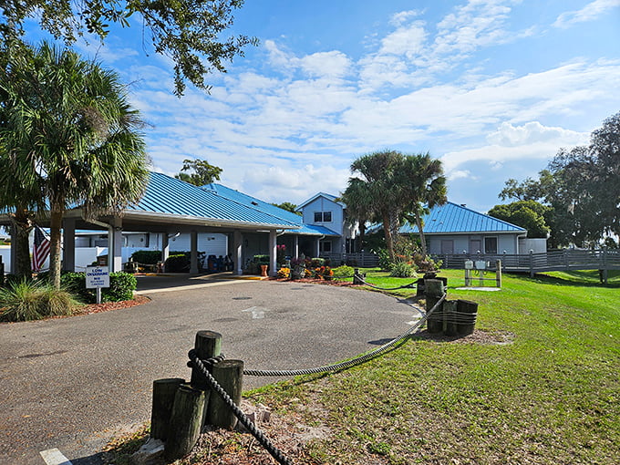 The iconic blue roof of Corky Bell's welcomes hungry travelers like a seafood mirage, promising delicious treasures under Florida's expansive sky.