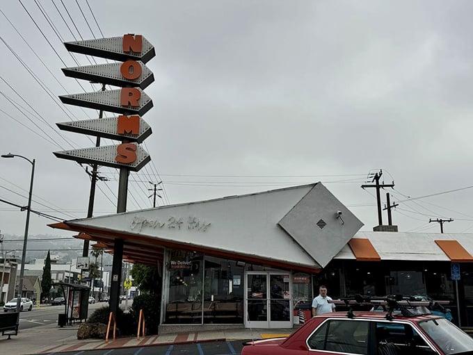 That iconic orange and white sign has been beckoning hungry Angelenos for generations—a neon lighthouse guiding the famished to safe harbor.