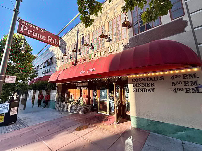That burgundy awning beckons like a beacon for beef lovers seeking San Francisco's most legendary prime rib experience.