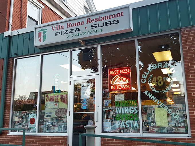 The unassuming storefront of Villa Roma hides culinary treasures within – like finding a Ferrari parked in your neighbor's modest garage.