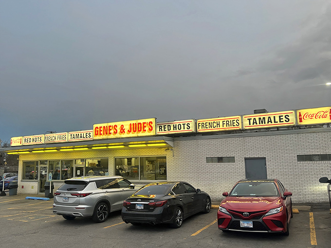 The white brick time machine on River Road beckons with its no-nonsense signage. RED HOTS, FRENCH FRIES, TAMALES—everything you need, nothing you don't.