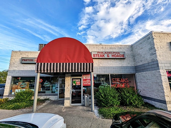 That iconic red awning isn't just eye-catching—it's a beacon calling sandwich lovers home to this unassuming strip mall treasure.
