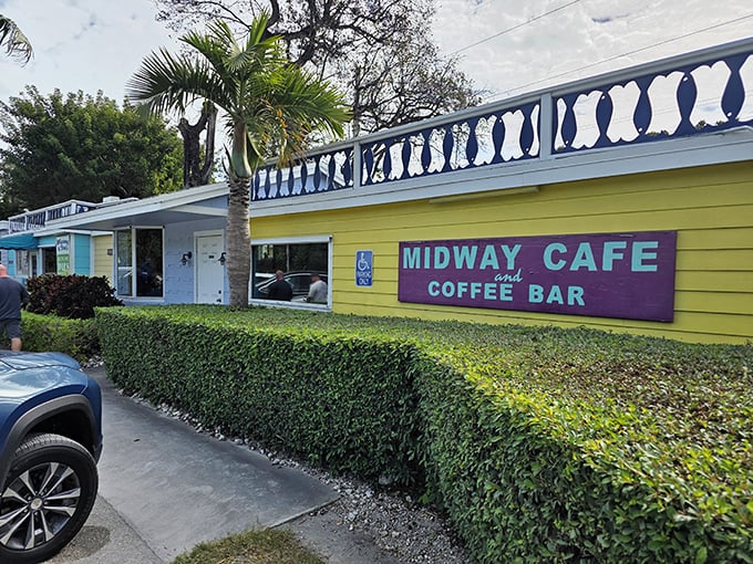 The lime-green exterior of Midway Cafe isn't just a building—it's a mood announcement that promises colorful experiences inside those vibrant walls.