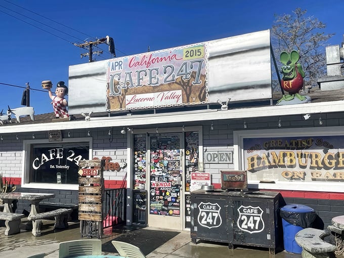The desert sun illuminates this roadside treasure like a mirage, complete with checkered flags and quirky decor that screams "pull over now!"