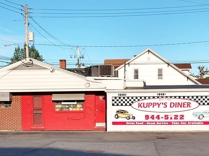 The cherry-red exterior of Kuppy's Diner isn't trying to be retro—it's the real deal, serving Middletown since 1933 with zero pretension and maximum flavor.