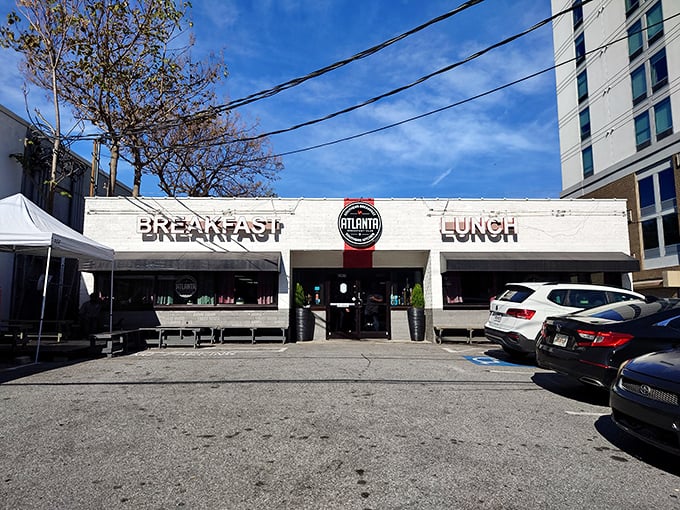 The unassuming white exterior of Atlanta Breakfast Club belies the culinary magic happening inside. Like finding a treasure map disguised as a parking ticket.