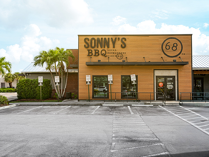 The wooden facade of Sonny's BBQ stands like a beacon of smoky promise against the Florida sky. No fancy frills needed when what's inside speaks volumes.