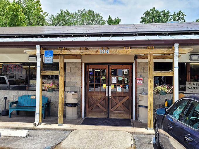 Those crossed wooden doors might as well be pearly gates for barbecue pilgrims. The unassuming exterior hides smoky treasures within.