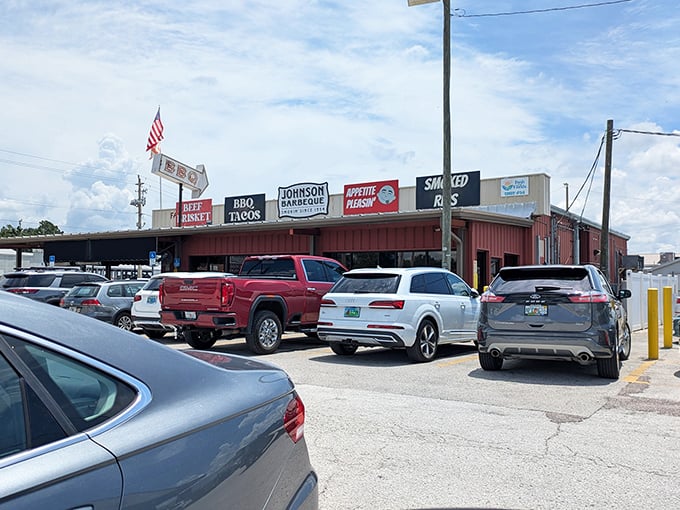 The neon glow of Johnson Barbeque's signage cuts through the night like a beacon for hungry souls. BBQ tacos, beef brisket, and smoked ribs—the signs tell you everything you need to know.