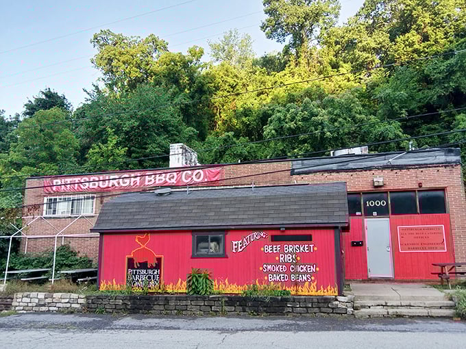 This brick building with flame decorations isn't trying to impress you with fancy architecture – it's too busy smoking meat to perfection.