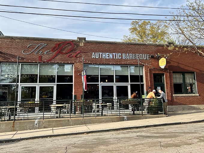 The brick fortress of flavor stands proudly on Davie Street, its unassuming exterior hiding the smoky treasures within. North Carolina barbecue paradise awaits.