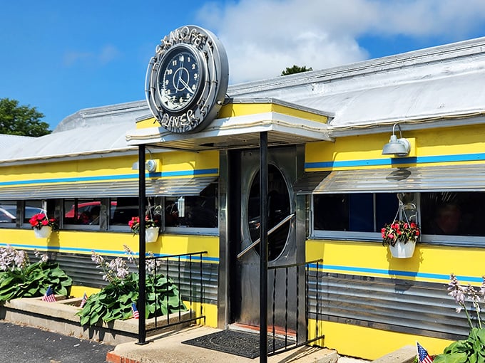 The gleaming stainless steel and sunny yellow exterior isn't just a diner—it's a time machine with a side of hash browns.
