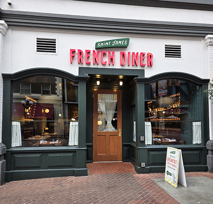 The emerald-green storefront with its glowing pink neon sign isn't just inviting—it's practically winking at you to come inside.