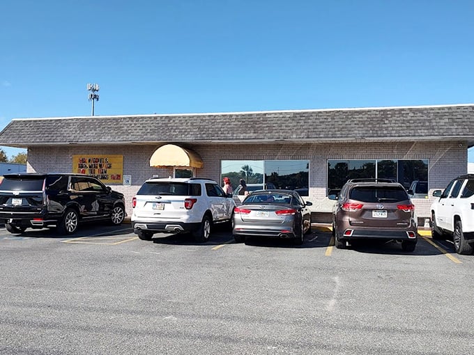 The unassuming brick exterior with its cheerful yellow awning is like a beacon for breakfast lovers. No fancy frills needed when the food speaks volumes.