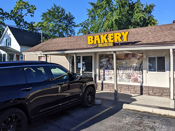 The bright yellow sign of Bakery Unlimited beckons like a sugary lighthouse on Toledo's horizon. Sweet salvation awaits inside!