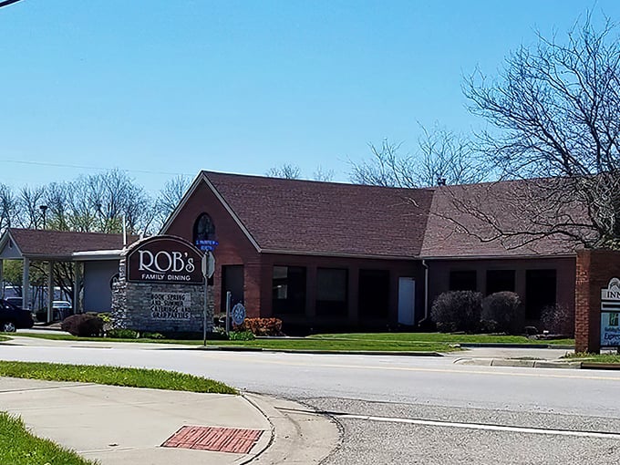 The brick exterior whispers "come in" while the landscaping practically shouts "we care about details here."