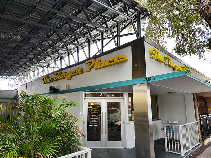 The bright yellow signage of The Burger Place beckons like a culinary lighthouse, promising burger salvation to weary downtown Melbourne wanderers.