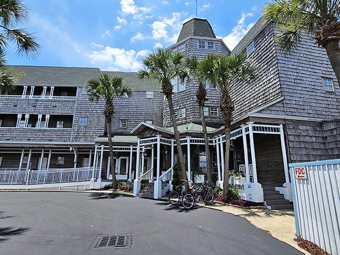 The Henderson Park Inn's weathered shingles and swaying palms create the perfect coastal disguise for Beach Walk Cafe's culinary treasures hiding within.