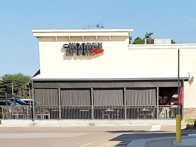 The welcoming exterior of The Wooden Spoon Diner beckons hungry travelers with its covered patio—Florida's answer to sidewalk cafés without the sunburn.