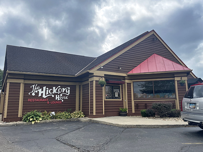 The rustic charm of Hickory House's exterior isn't just inviting—it's practically winking at you to come inside. Those flowers aren't just decoration; they're nature's welcome committee.