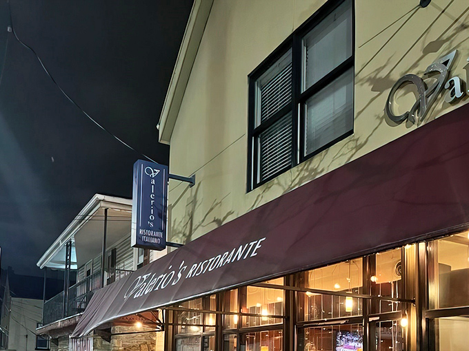 The burgundy awning and warm glow of Valerio's at night—like a beacon calling all pasta pilgrims home to roost.
