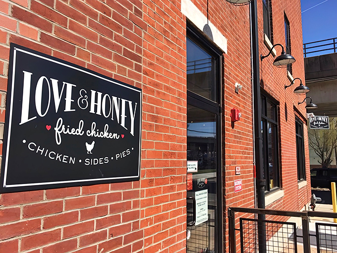 That charming brick facade and welcoming storefront practically whispers "come discover something delicious" to every passerby.