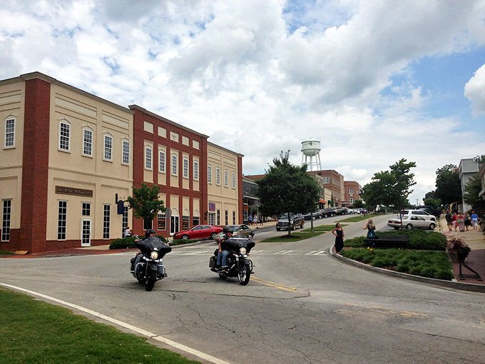 Main Street perfection unfolds where classic red brick buildings create America's most photogenic downtown corridor.