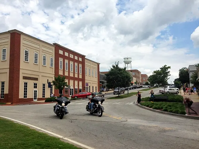 Main Street perfection unfolds where classic red brick buildings create America's most photogenic downtown corridor.