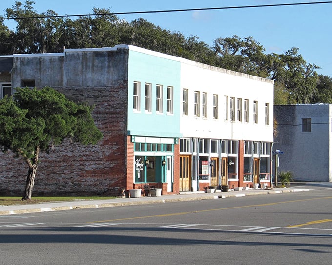 Highway signs pointing to Brunswick and Savannah – the perfect roadmap for your coastal Georgia adventure where small-town treasures await between big-city destinations.
