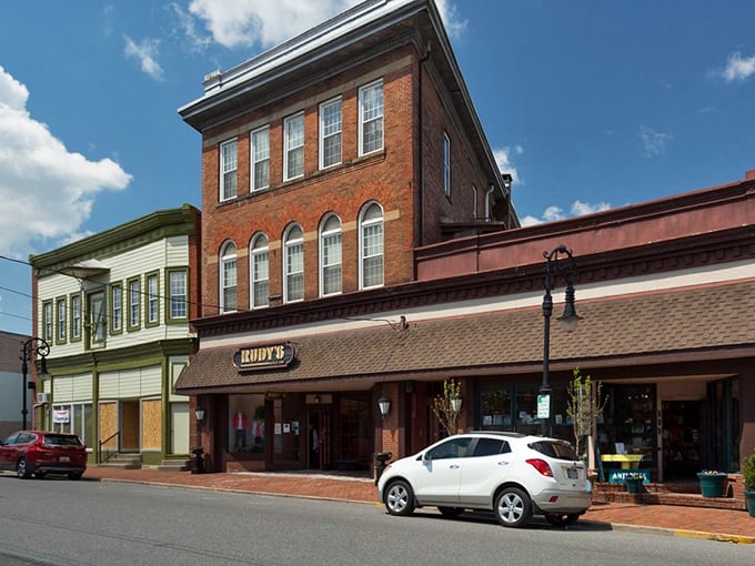Historic storefronts with bright red awnings – like a Norman Rockwell painting that somehow serves excellent coffee and Wi-Fi.