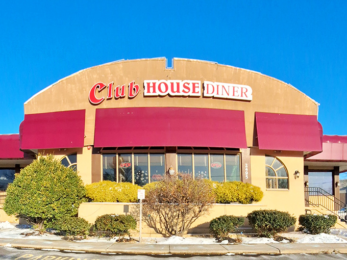 The iconic red awnings of Club House Diner beckon like a culinary lighthouse, promising comfort and satisfaction to hungry Bensalem travelers.