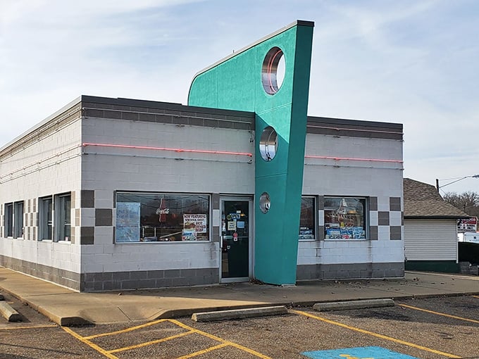 That iconic teal fin isn't just architectural flair—it's a beacon calling hungry time-travelers to Alliance's most authentic slice of the 1950s.