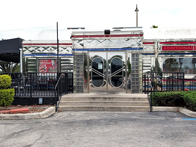 That gleaming silver exterior with bold red lettering isn't just eye-catching—it's a time portal to when Elvis was king and milkshakes were breakfast food.