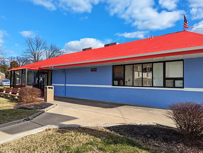 The bright blue exterior with its cherry-red roof stands like a beacon of comfort food promise on Wilmington's landscape.