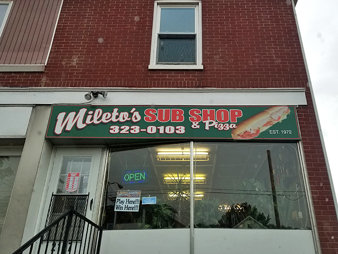 The unassuming brick façade of Mileto's hides culinary treasures that locals have cherished since 1972. Some buildings don't need to shout—their sandwiches do the talking.