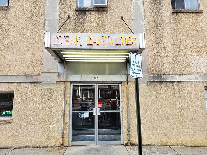 The unassuming entrance to Zandy's Steak Shop, where that vintage "STEAK SANDWICH" sign has been guiding hungry Allentonians to cheesesteak nirvana for generations.