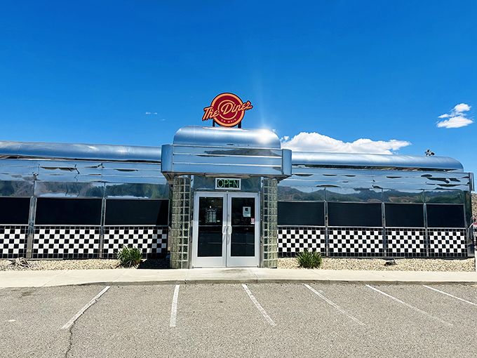 The gleaming chrome exterior of Diner on Main stands like a time machine in the Arizona desert, beckoning hungry travelers with its classic 1950s silhouette.