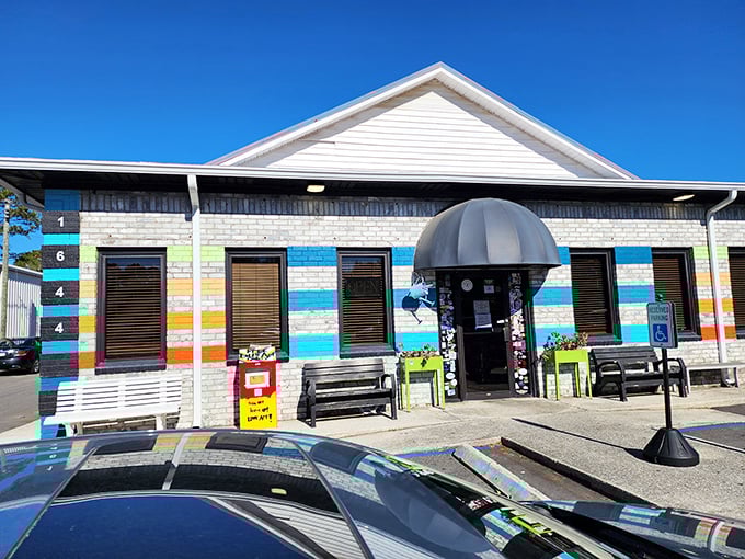 The colorful exterior of Early Bird Diner beckons like a rainbow after a Charleston rainstorm. Those vibrant stripes aren't just decoration—they're a promise of the personality waiting inside.