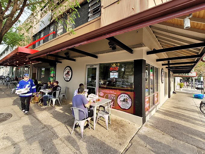 The unassuming corner spot where pizza dreams come true. Eddie and Sam's exterior might be modest, but inside awaits New York pizza perfection.