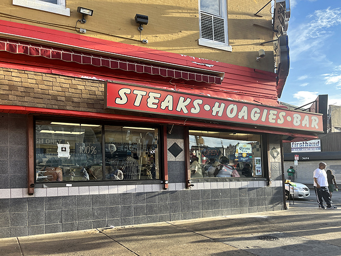 The iconic yellow and red façade of Max's Steaks stands as a beacon of culinary authenticity on North Broad Street, promising Philadelphia's ultimate comfort food experience.