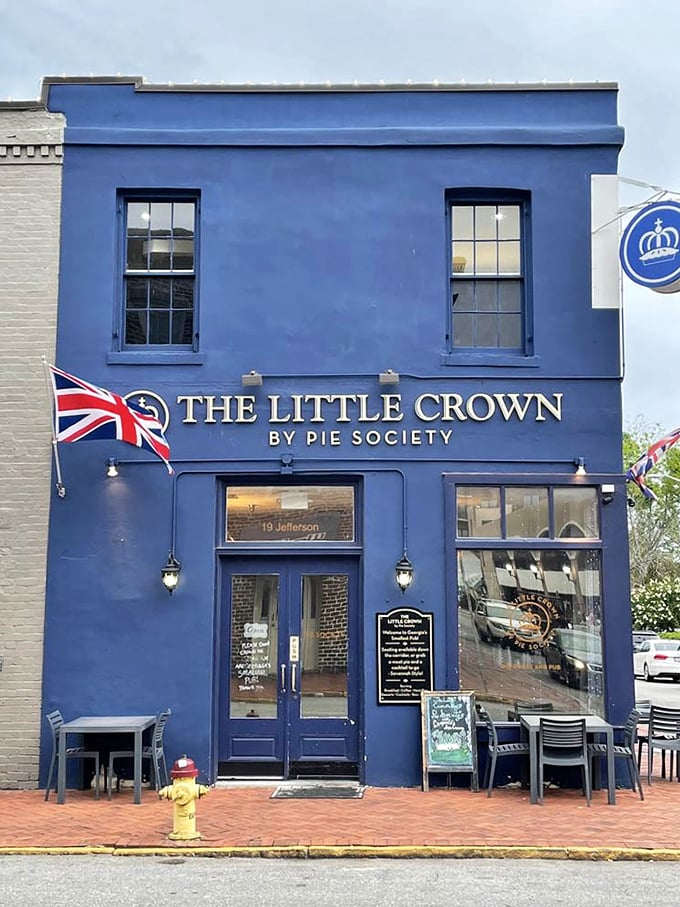 The Little Crown stands proudly in Savannah's City Market, its royal blue exterior and Union Jack flags announcing "British pies ahead!" like a delicious embassy.