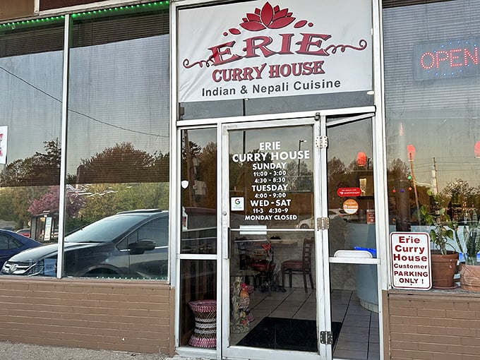 The unassuming storefront of Erie Curry House beckons with its simple red lotus logo and promise of Indian and Nepali cuisine—proof that culinary treasures often hide in plain sight.