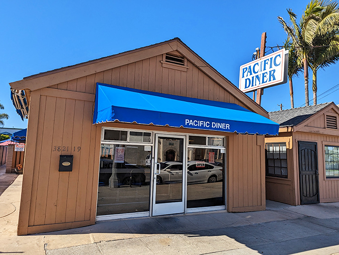The unassuming exterior of Pacific Diner stands like a culinary lighthouse in San Pedro, its bright blue awning a beacon for breakfast seekers.