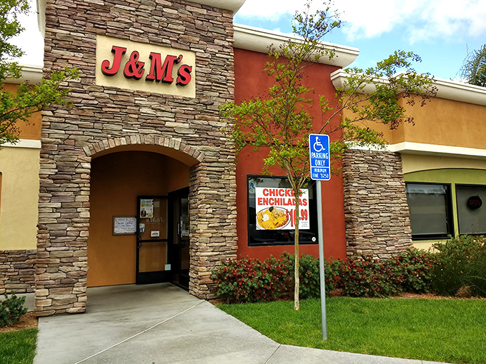 The stone facade of J & M's welcomes hungry travelers like a culinary lighthouse in Escondido's commercial landscape. No pretension, just the promise of good eating ahead.