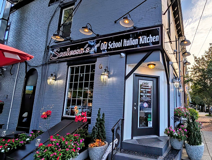 The blue brick exterior of Scalessa's isn't just charming—it's a beacon of culinary promise with those flower boxes practically shouting, "Good food happens here!"