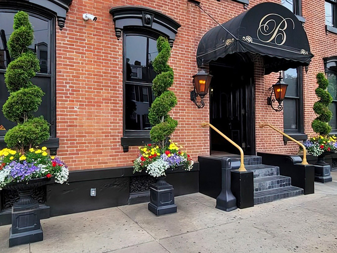 The elegant brick façade of The Belvedere Inn welcomes you with spiral topiaries and colorful flower displays. Victorian charm meets culinary excellence.
