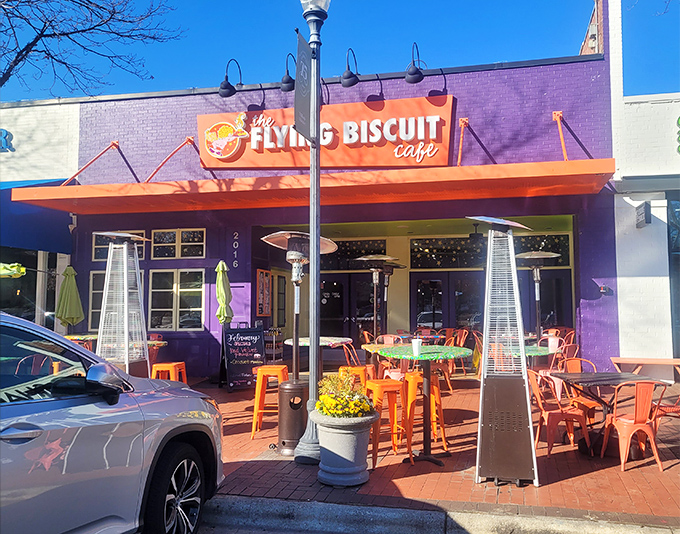 The purple building with its vibrant orange awning isn't just a restaurant—it's a morning beacon calling breakfast enthusiasts home.