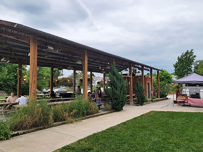 The outdoor setup at Eli's BBQ feels like stumbling upon a backyard cookout where everyone's invited. Those string lights aren't just for show—they're beacons guiding hungry souls home.