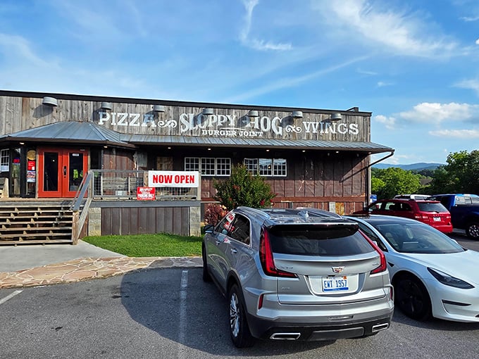 The rustic wooden exterior of Sloppy Hog stands like a delicious mirage against the Smoky Mountain backdrop, promising comfort food that'll make your cardiologist wince with delight.